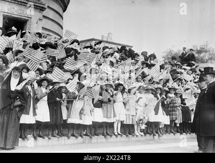 Photograph of women waving flags to welcome Ambassador Francisco ...