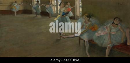 .Ballet, classroom and group of women stretching on floor together for ...