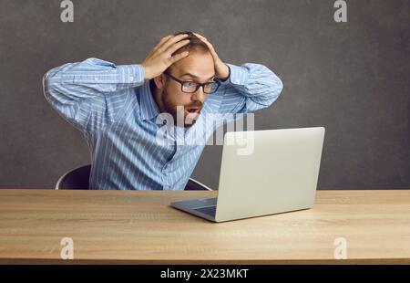 Surprise read head man playing with leaves and looking at camera ...