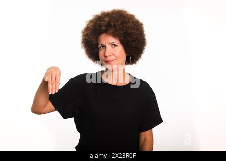 Female interpreter of the Brazilian sign language, Libras, making the ...