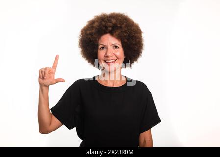 Female interpreter of the Brazilian sign language, Libras, making the ...