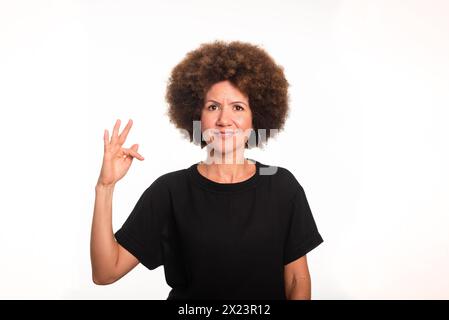 Interpreter of the Brazilian sign language, Libras, making the letter B ...