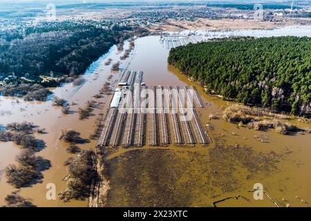Farmland flooded with water during a strong river flood in spring, view ...