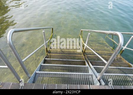 Steel stairs with railings for waterfront access. Side view showing ...