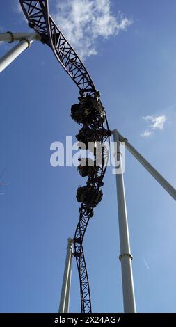 People have fun during an overhead element on the launch roller coaster ...