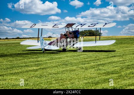 G-EMSY 1930s De Havilland Gypsy Major aircraft taxiing down the grass ...