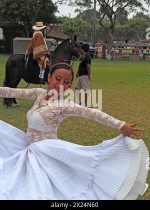 Creole woman in typical costume dancing “Marinera”, a traditional dance ...