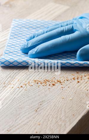 Cleaning wiping wood countertop worktop with a disposable cloth ...