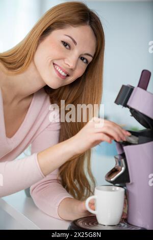 woman making fresh espresso in coffee maker Stock Photo - Alamy