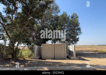 Steel-reinforced precast concrete blast wall placed around a ...