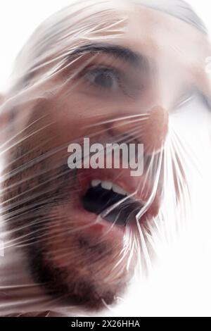 Man, plastic and bag with choking, breath and struggle for breath in ...