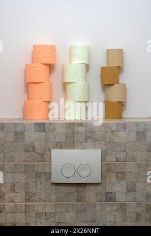 Toilet rolls and toilet button. Rolls of two colors. Rows of Toilet ...