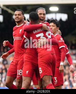 Liverpool's Ryan Gravenberch celebrates with the Premier League trophy ...