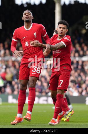 Liverpool's Ryan Gravenberch celebrates with the Premier League trophy ...