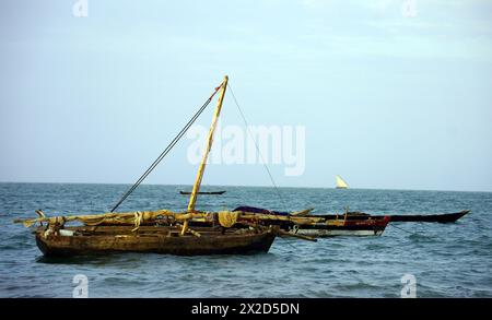 Dhow with mast moored near the shore on the northern Tanzanian coast ...