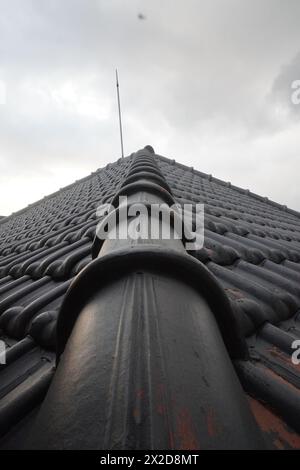A lightning rod mounted on a roof with a cloudy sky background Stock ...