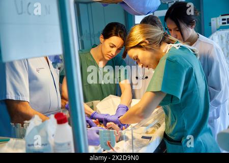 Team of doctors and nurses attending to a baby, Neonatal pediatrics ...