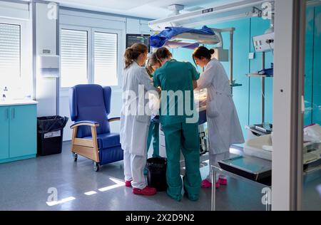 Team of doctors and nurses attending to a baby, Neonatal pediatrics ...