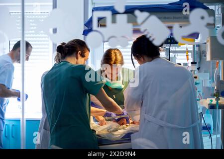 Team of doctors and nurses attending to a baby, Neonatal pediatrics ...
