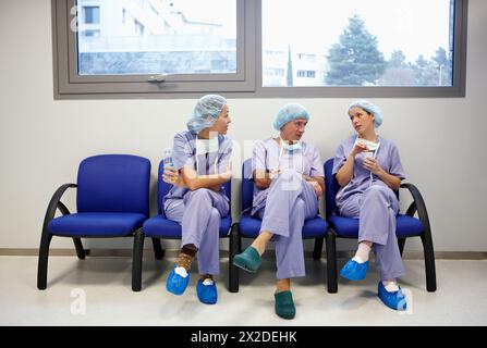 Surgeons taking a coffee in break room, surgical block. Hospital ...