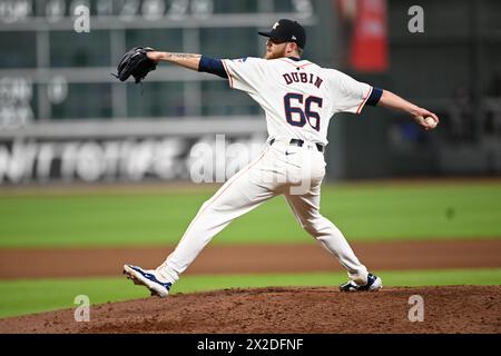 Houston Astros pitcher Shawn Dubin (66) reaches to tag out Minnesota ...
