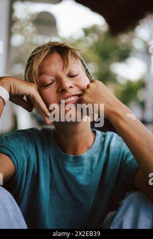Close up of happy millennial woman holding gift bags on white Stock ...