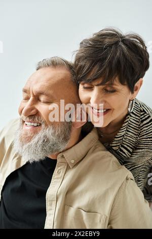Middle age man and woman partners wearing scientist uniform drinking ...