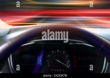 Speedometer behind steering wheel in car, motion blur effect Stock ...