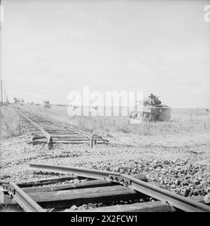 27th Armoured Brigade Sherman tanks of the British Army move near ...