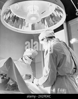 Student nurse Joyce Collier assists a doctor during a routine patient ...