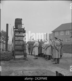 British Army personnel use a shower bath provided by the Mobile Baths ...