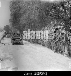 Major General T W Rees, commanding the 19th Indian Division, is in ...
