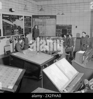A photograph shows an artillery group command building under ...