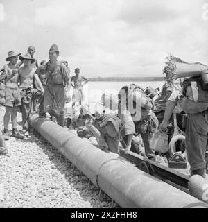 Japanese 52nd Division troops arrive at a bridge on the Sittang River ...