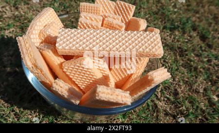 Tasty Wafer biscuits served in a transparent bowl. Orange flavoured ...
