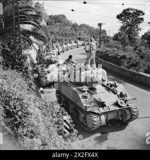 Sherman tanks of the Eighth Army advance towards a bridge over the ...