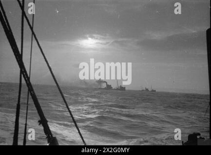 MINESWEEPERS AT WORK. 1940, OR 1941, ON BOARD A MINESWEEPER AT SEA ...