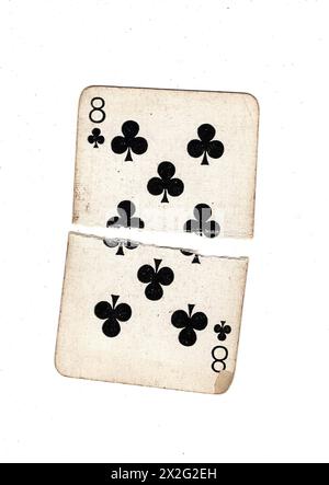 A torn half of a vintage, well used eight of hearts playing card ...