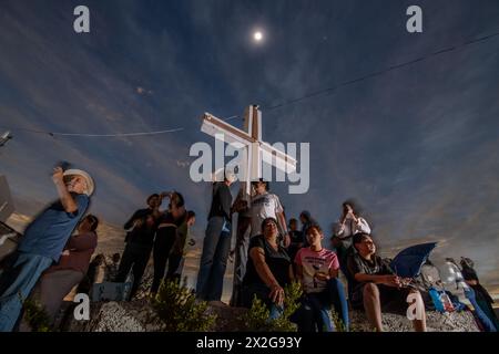 Eclipse watchers gather around cross , Nazas Mexico Stock Photo - Alamy
