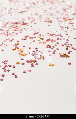 Shimmer stars and blue crystals confetti on a silver background. Shiny ...