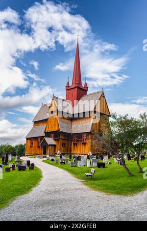 13th century medieval Ringebu Stave Church stands amidst headstones ...
