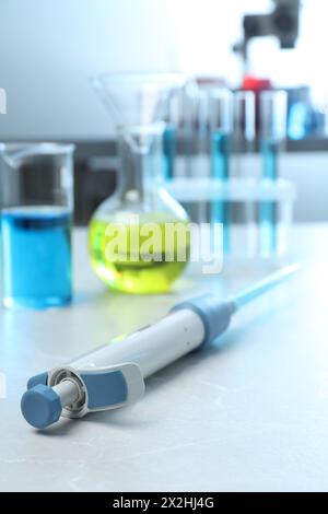 Test tubes on grey marble table, closeup. Laboratory glassware Stock ...