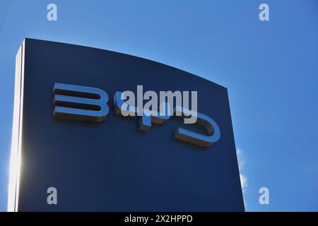 Pole billboard with logo BYD on blue sky backgroundApril 20th 2024 ...