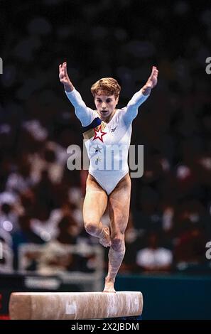 Kerri Strug (USA) competing on the the balance beam in the women's ...