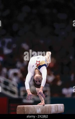 Kerri Strug (USA) competing on the the balance beam in the women's ...