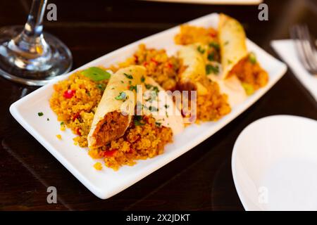 Tasty Moroccan lamb spring roll with harissa and couscous Stock Photo ...