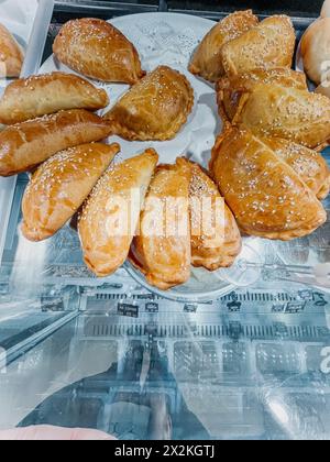 Delicious pies in a plate freshly cooked - Wooden Background Stock ...