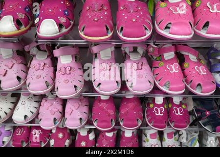 Children's Shoes on store counter Stock Photo - Alamy