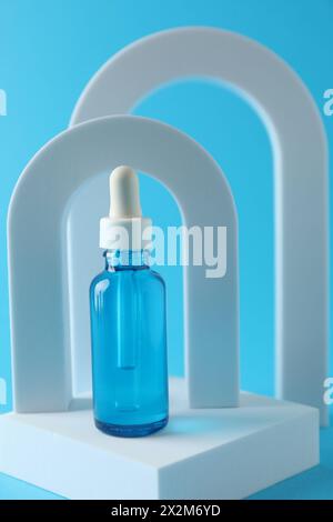 Stylish presentation of serum on light blue background Stock Photo - Alamy
