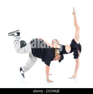 Rapper holds leg of gymnast girl with green ball isolated on white ...